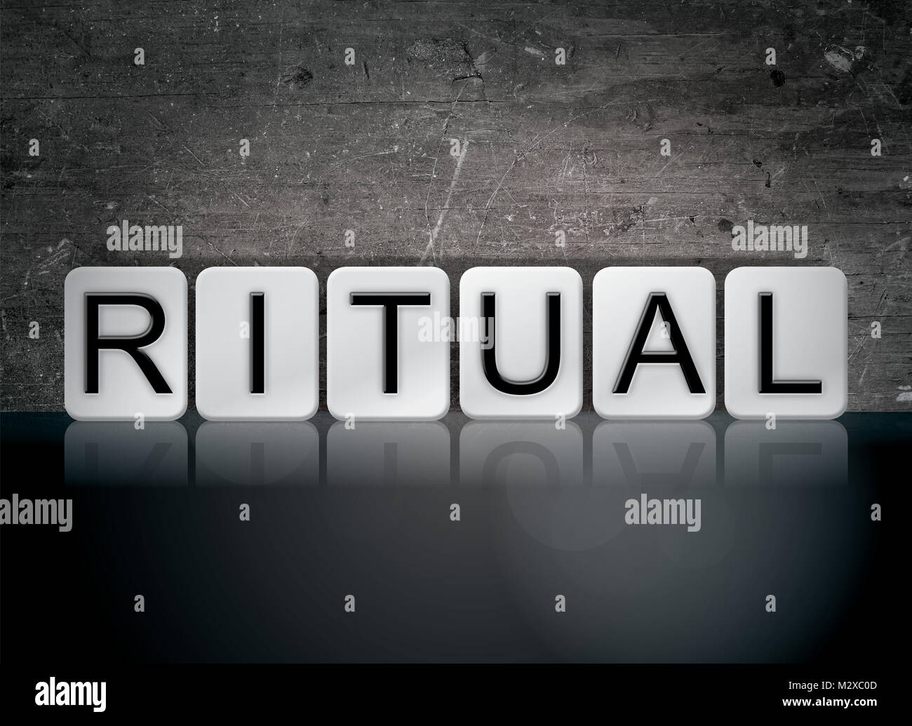 The word Ritual concept and theme written in white tiles on a dark ...