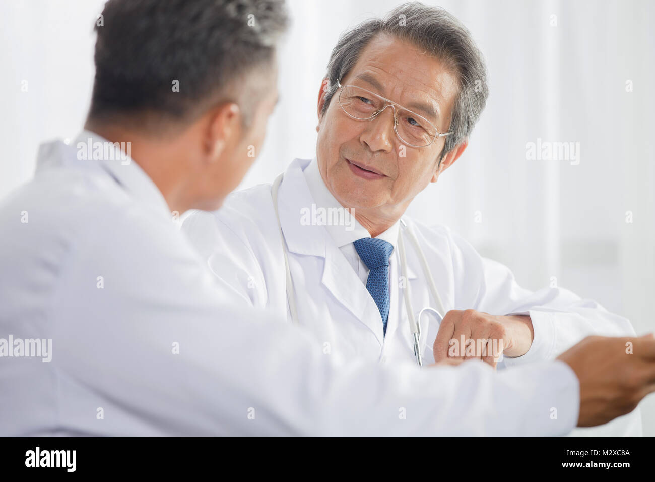 The doctor in the communication meeting Stock Photo - Alamy