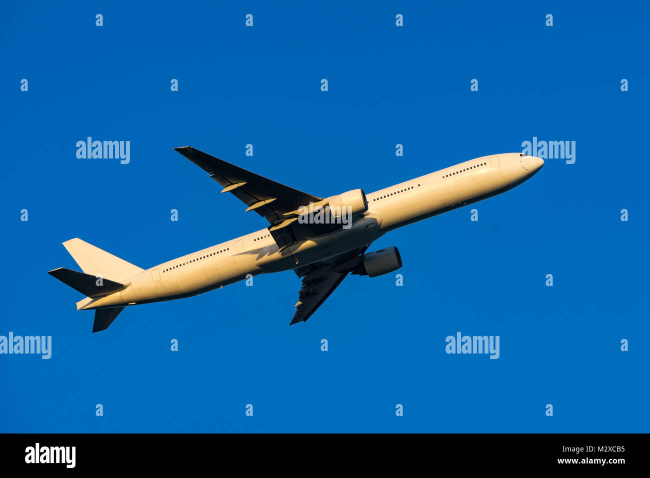 Boeing 777-300 taking off from the airport at dusk Stock Photo - Alamy