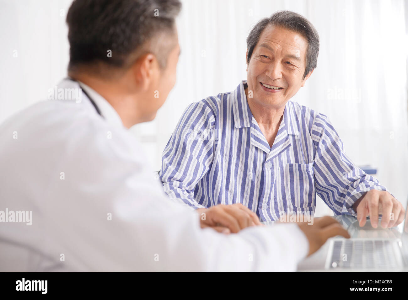 The doctor and the patient communication Stock Photo - Alamy