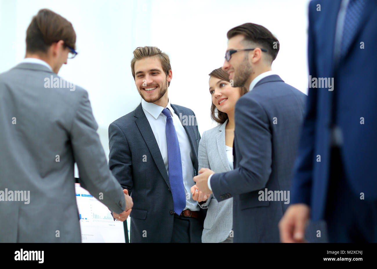 Confident young people, handshake and smile Stock Photo - Alamy