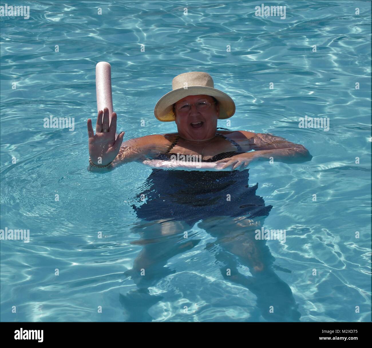 Older woman swimming in pool hi-res stock photography and images - Alamy