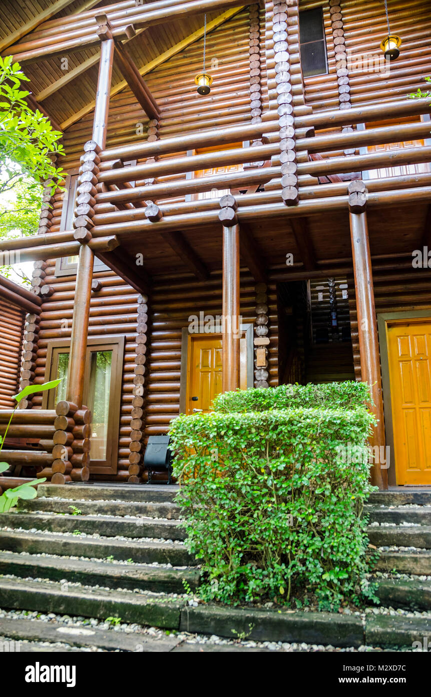 Log house - Cozy log house amongst green environment Stock Photo - Alamy