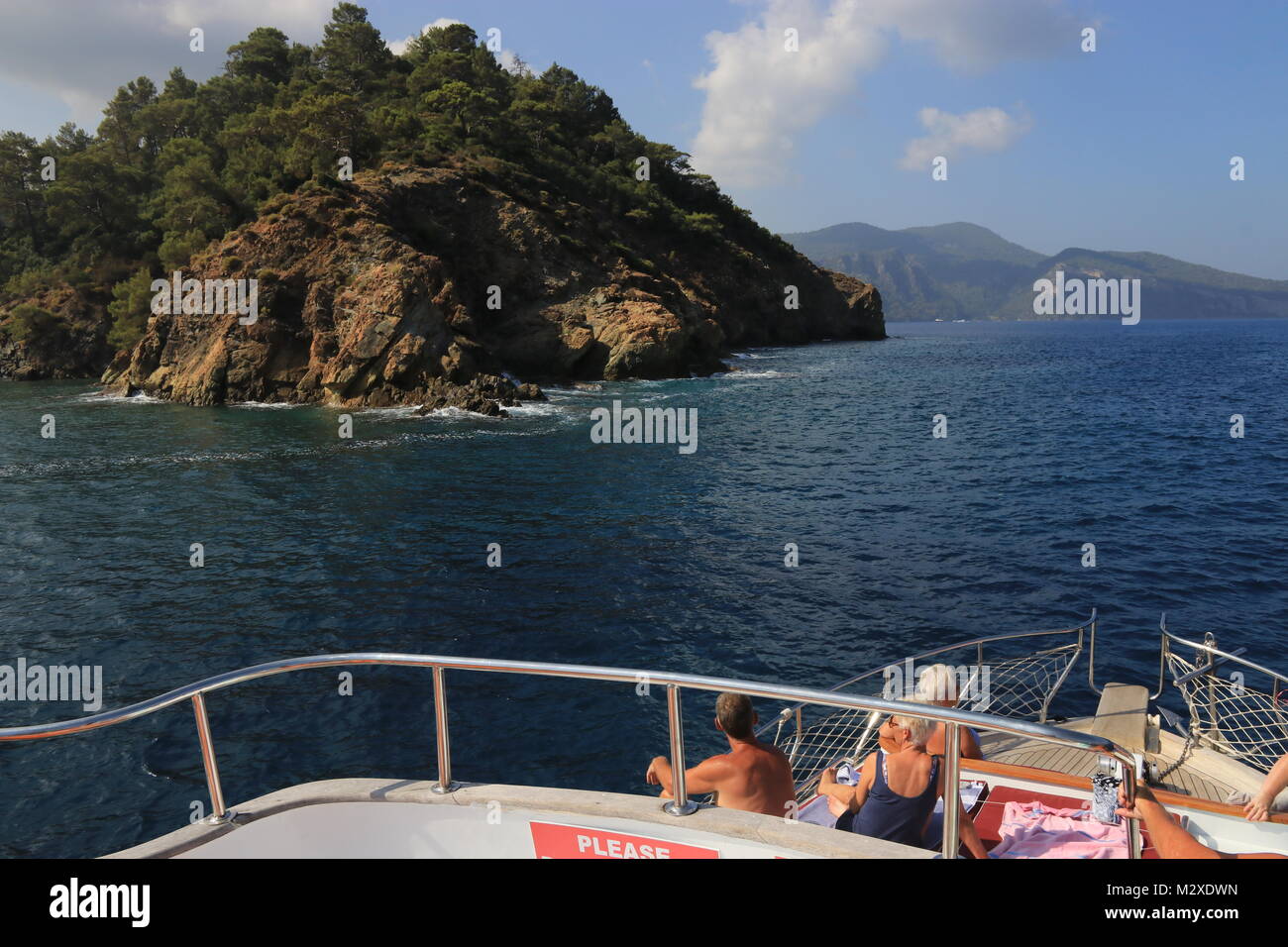 English tourists on a boat trip around the bays of fethiye in Turkey ...