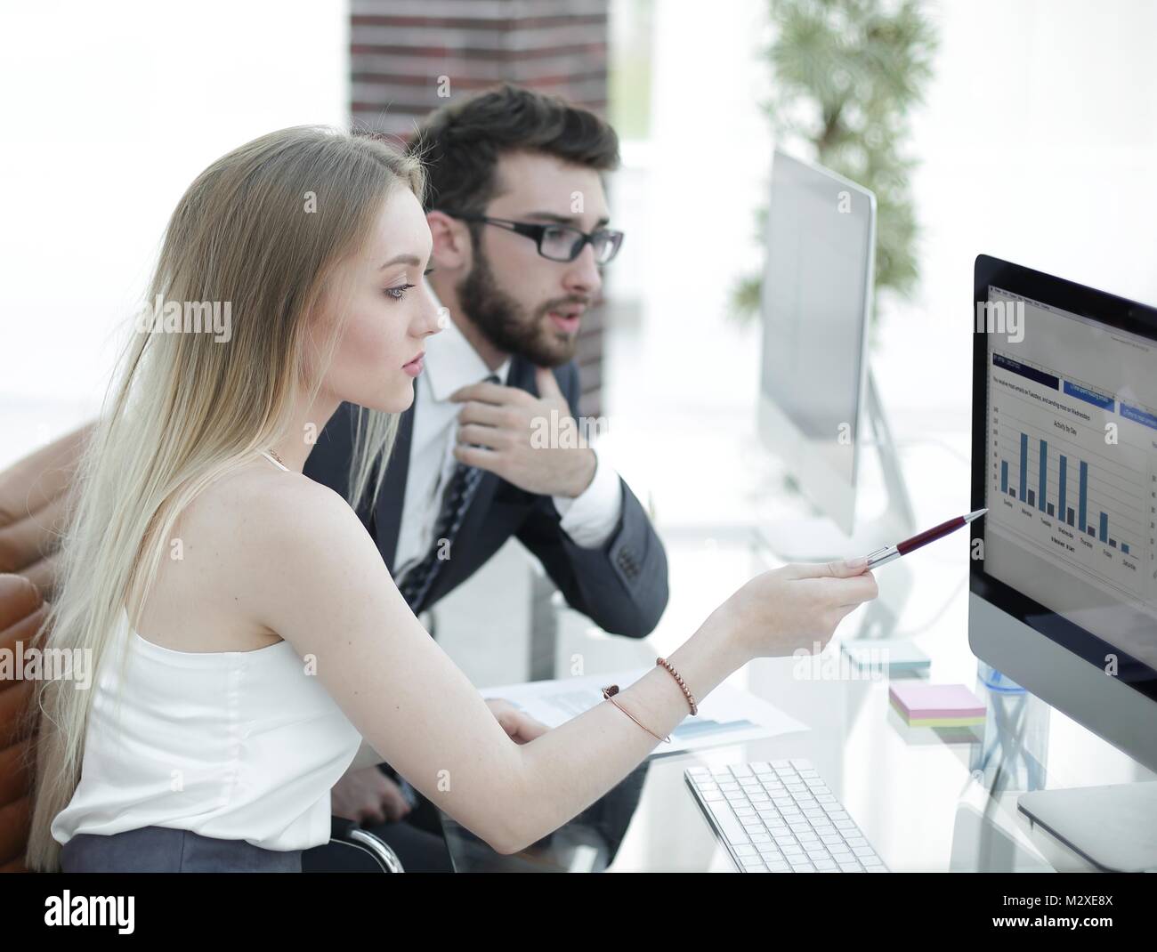 Senior manager and employee discussing financial documents Stock Photo ...