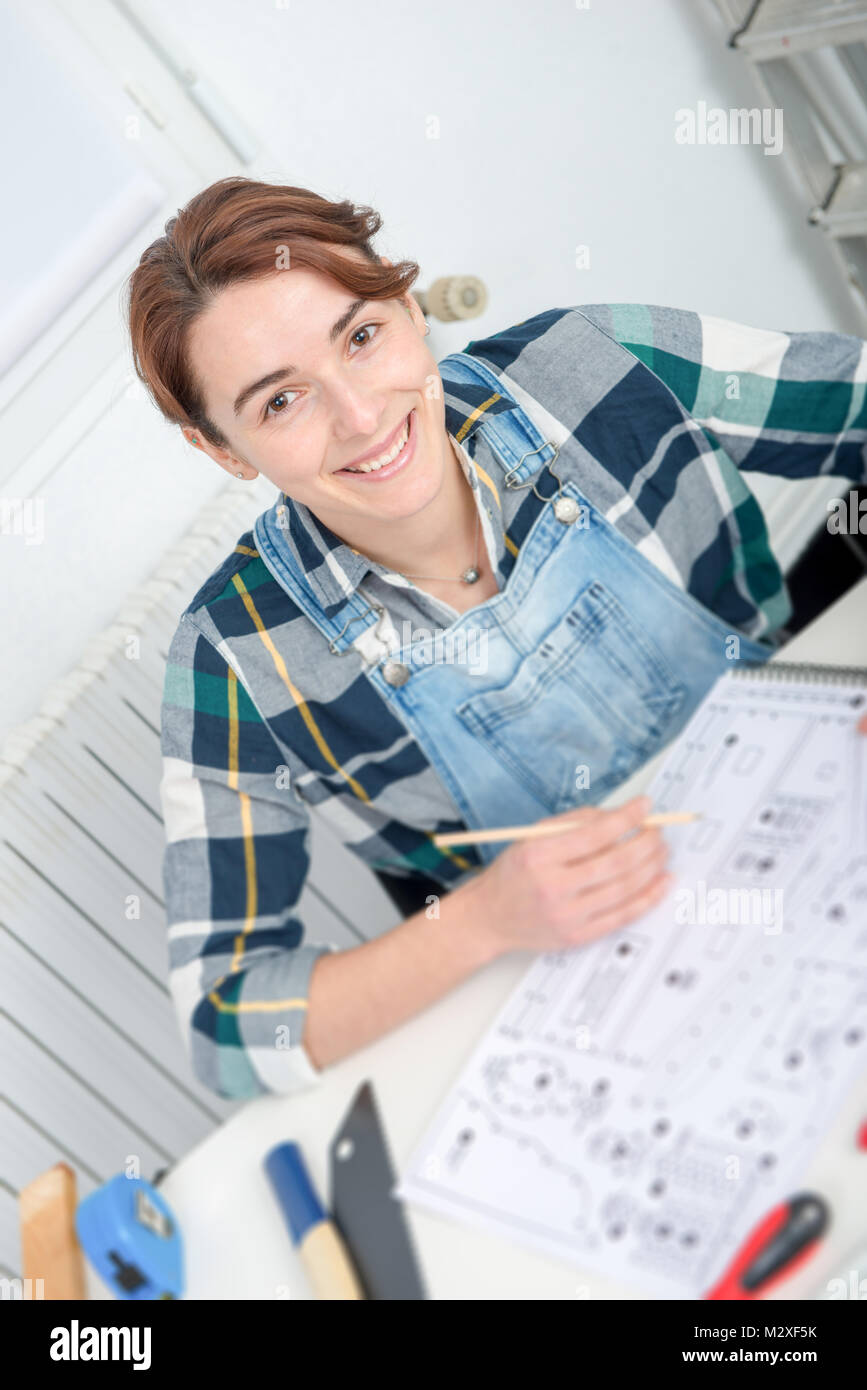 a pretty young woman doing DIY work at home Stock Photo - Alamy