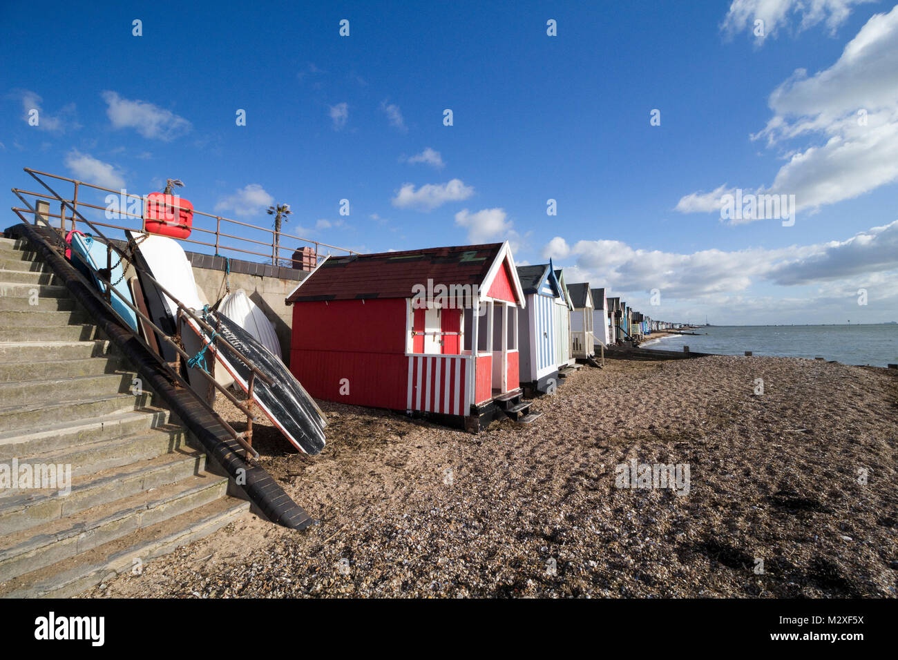 Boats and beach huts on Thorpe Bay beach, near Southend-on-Sea, Essex ...