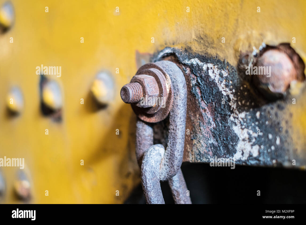 rusty chain on rusted nut closeup - industrial detail Stock Photo - Alamy