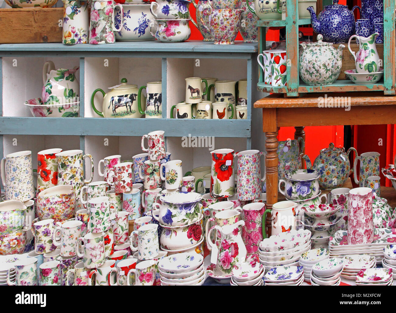 Colorful pottery on outside vintage market stall Stock Photo - Alamy