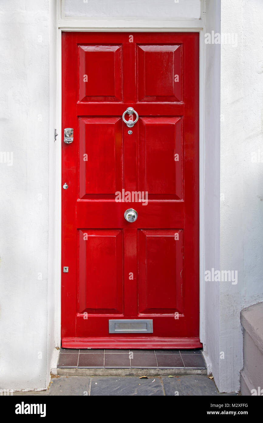 Red entrance door in front of residential house Stock Photo - Alamy