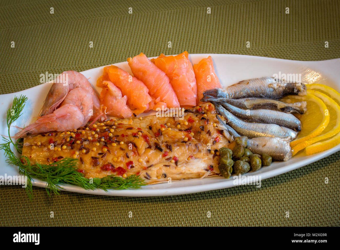 Seafood - salmon, shrimp, sprat, smoked mackerel with spices and capers ...