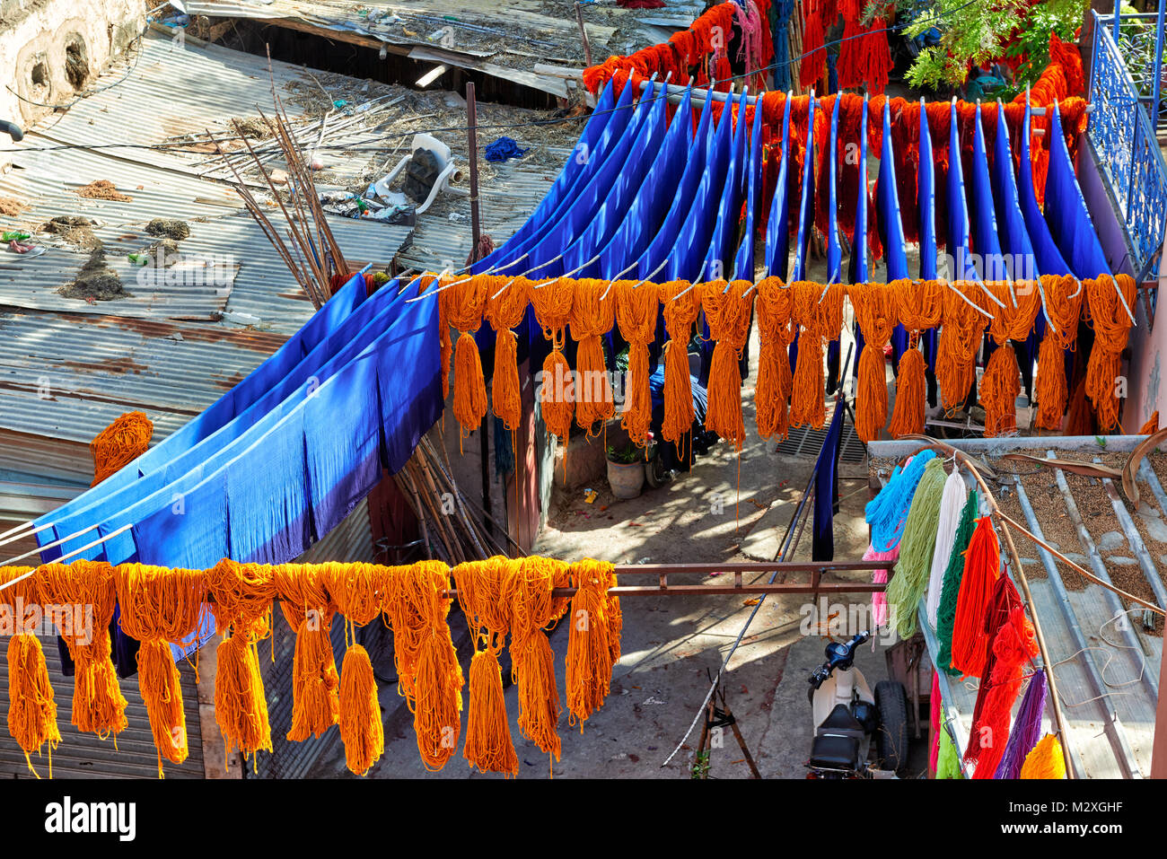 Brightly coloured wool hanging to dry in the dyers souk, textile souk ...