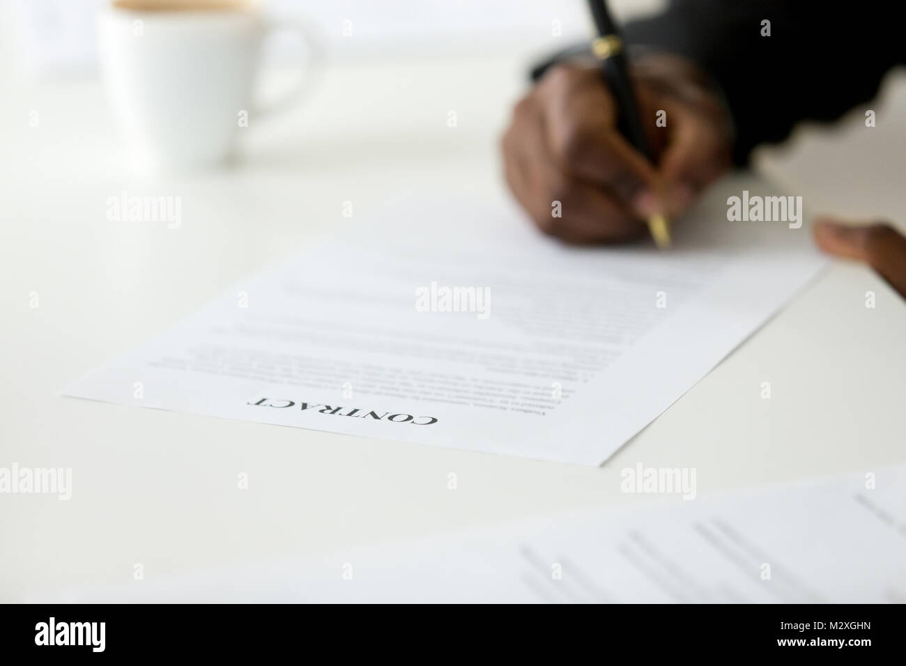 African hand signing legal document hi-res stock photography and images ...