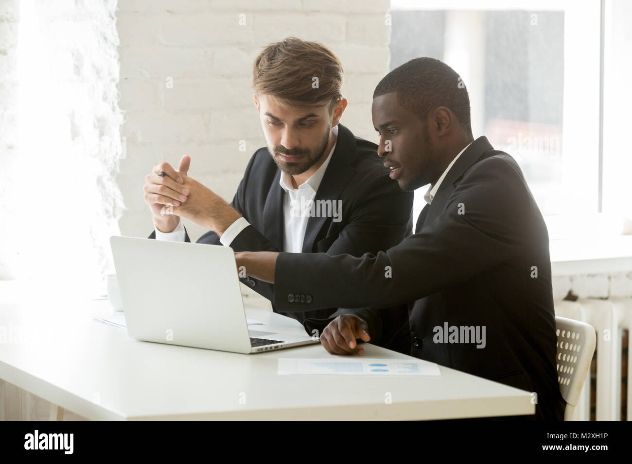 Business colleagues in suits hi-res stock photography and images - Alamy