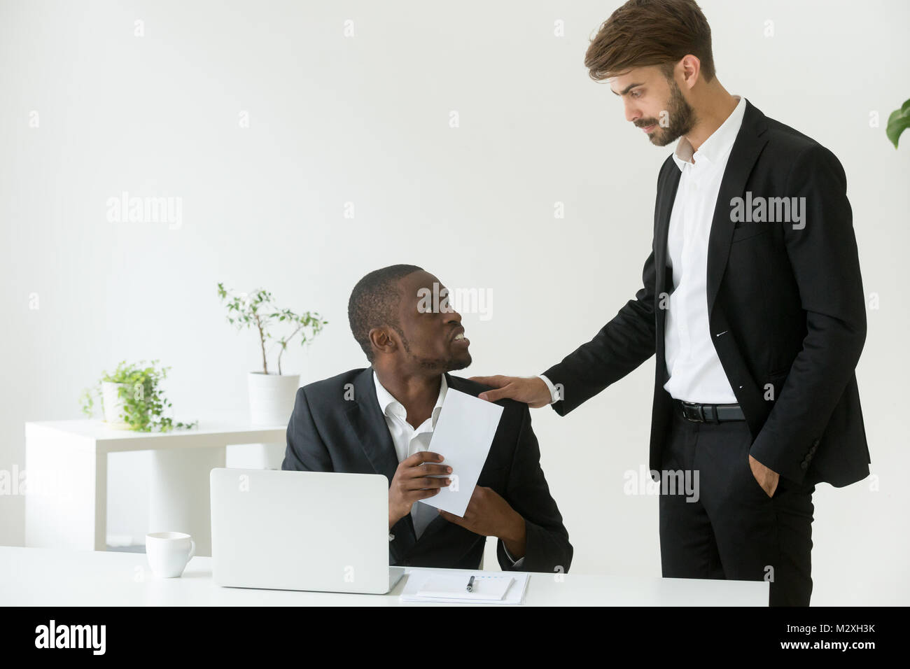 African-american office worker receiving envelope with reward fr Stock ...