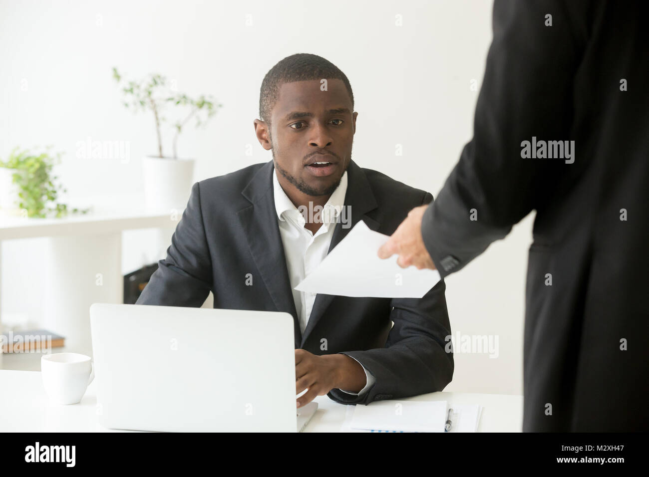 Surprised shocked african businessman getting unexpected notice Stock ... Surprised shocked african businessman getting unexpected notice Stock ...