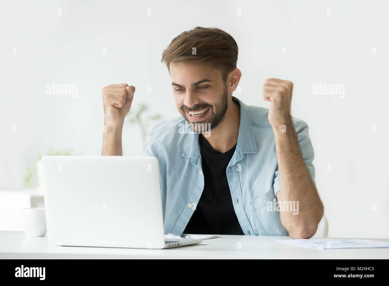Excited businessman reading email laptop hi-res stock photography and ...