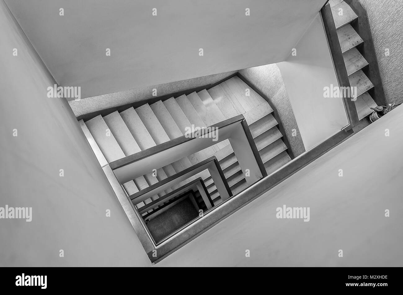 Top view of the stairwell in masonry and marble, floors seen from the ...