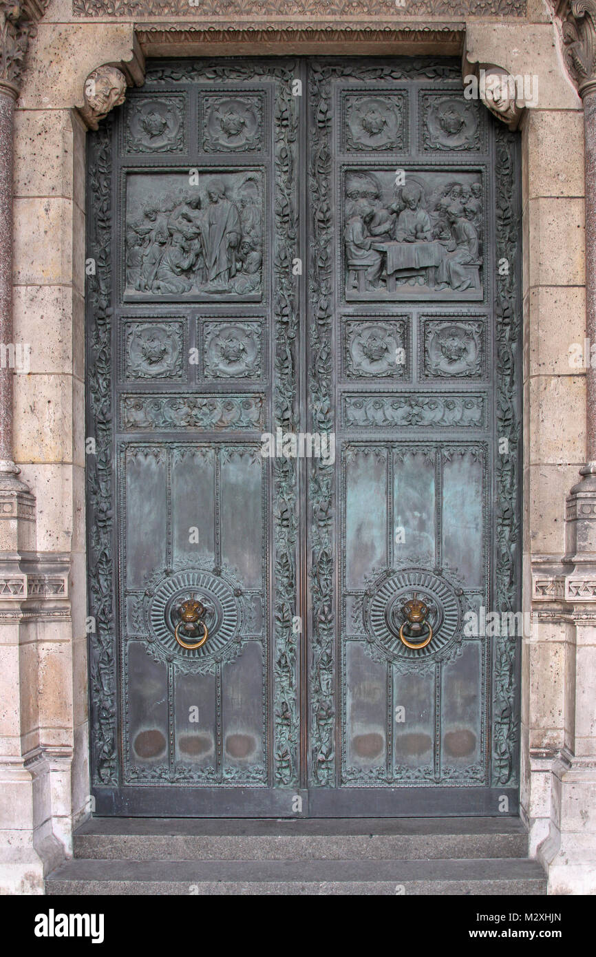 Large metal door on ancient church with engraved details Stock Photo ...