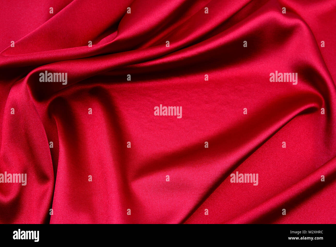 Closeup of ripples in red silk fabric Stock Photo - Alamy
