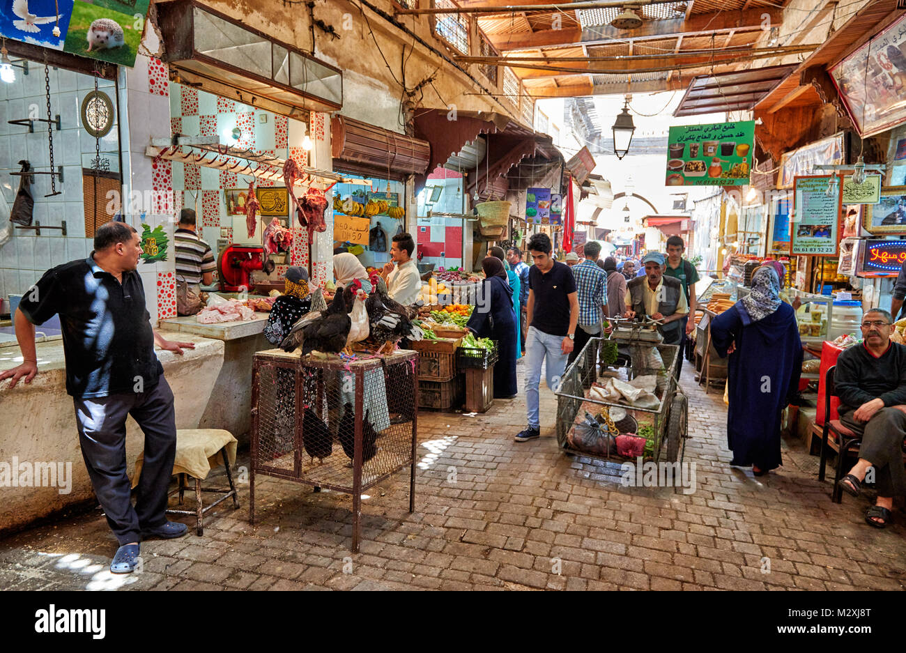 market stalls with food in the narrow alleys in old town (medina) of ...