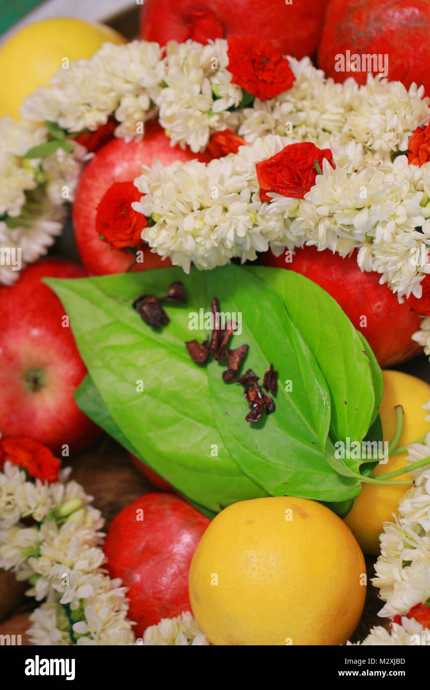 Stack of betel leaf with fruits and flowers Stock Photo - Alamy