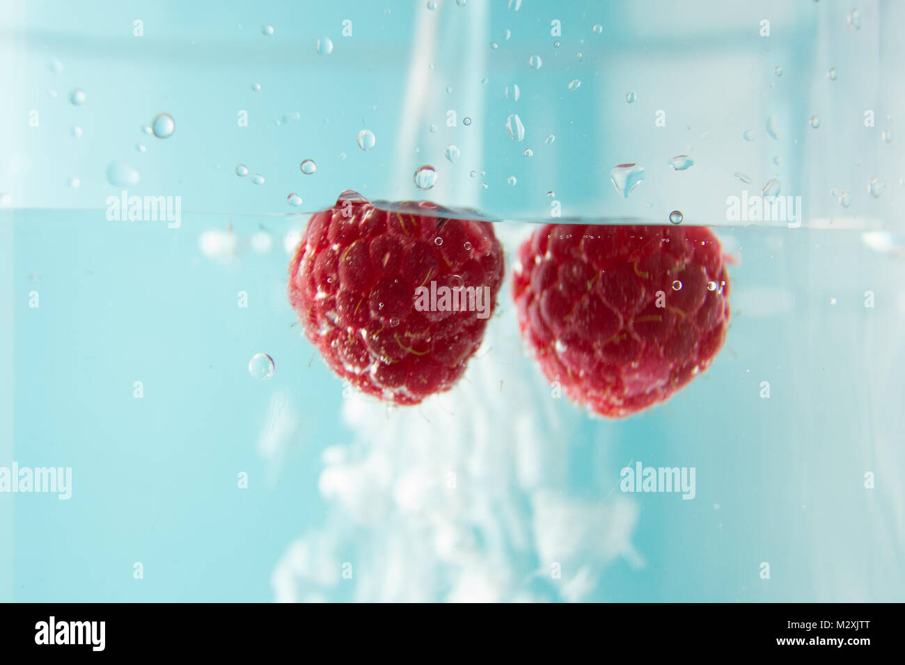 Red berries falling in water hi-res stock photography and images - Alamy