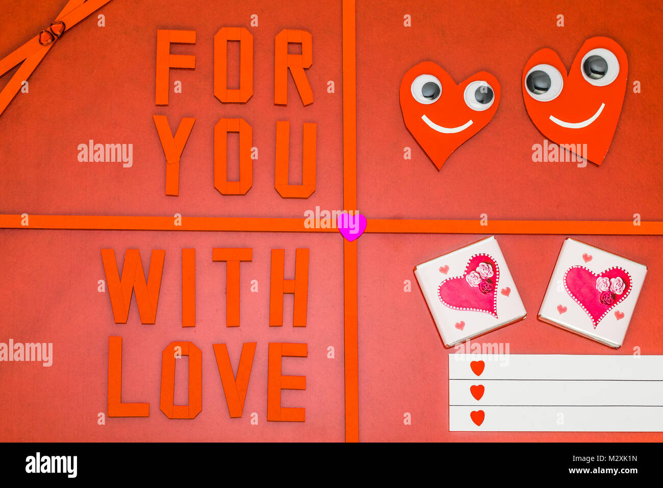 Greeting card "Hearts with eyes + For You with love" on colored ...