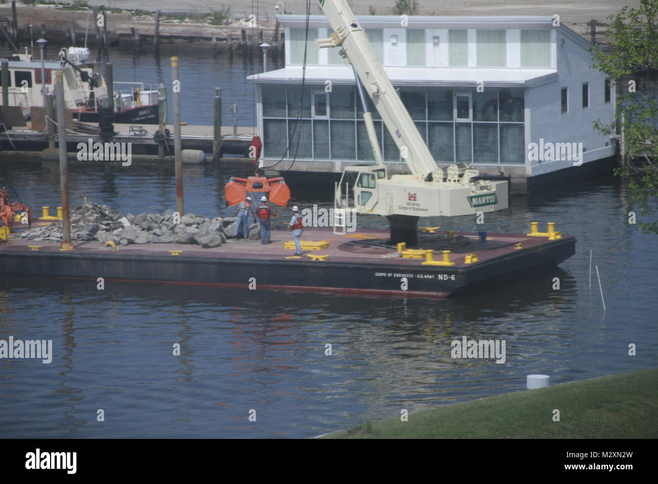 A U.S. Army Corps of Engineers barge, loaded with mortar and broken ...