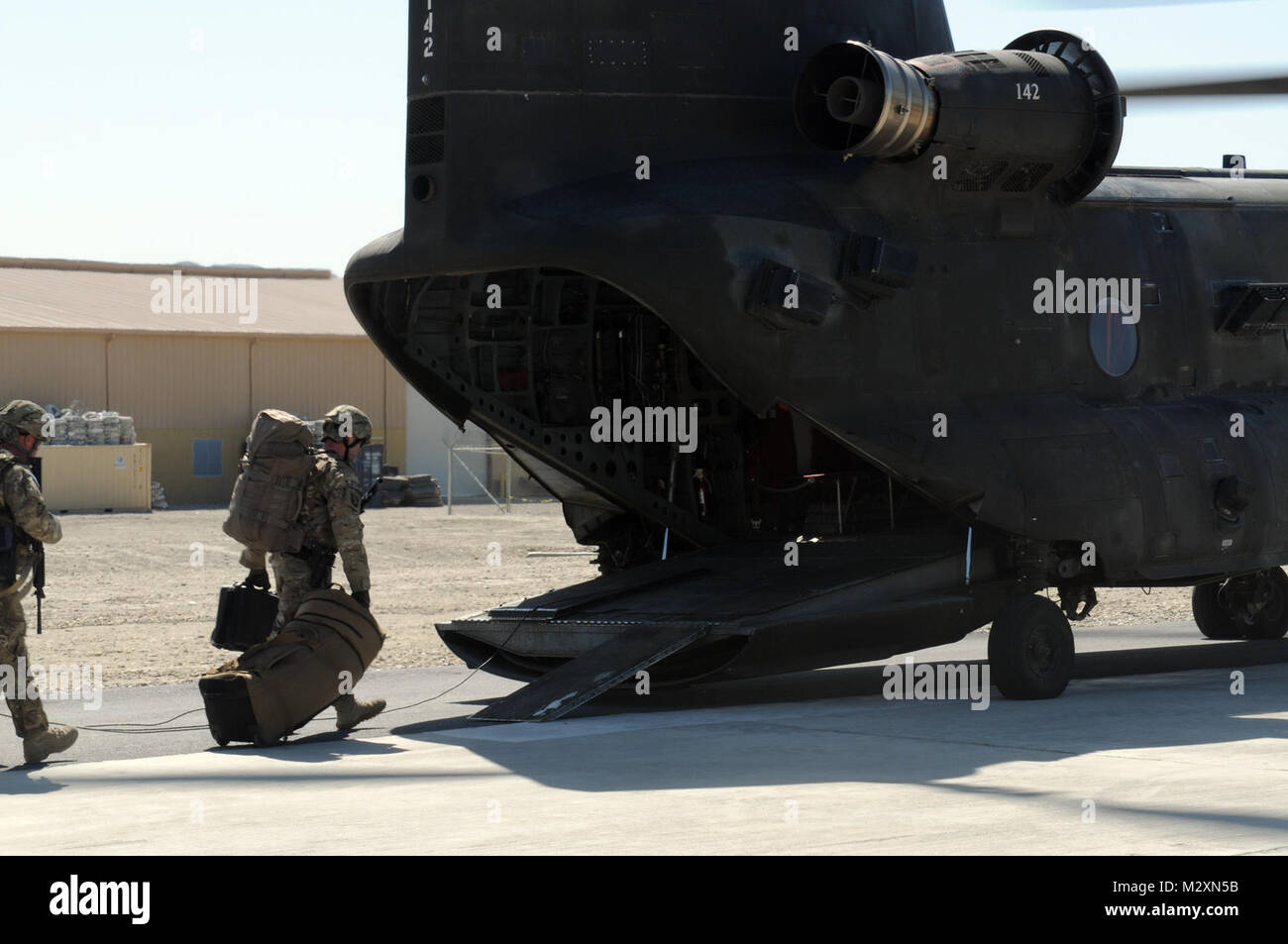 A soldier with the Oklahoma Stability Transition Team boards a CH-47 ...