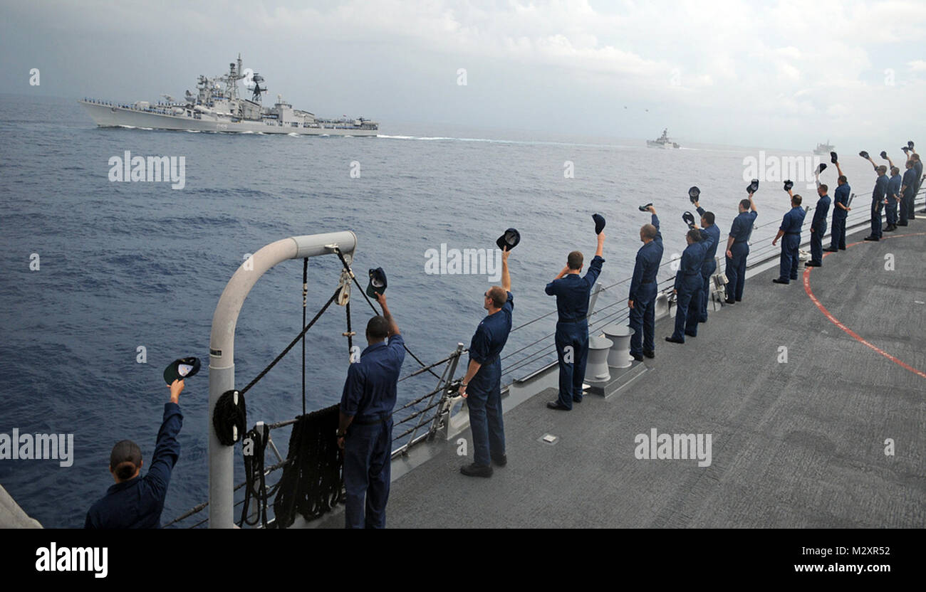 USS Halsey Sailors wave at passing Indian Ships during a Malabar 2012 ...