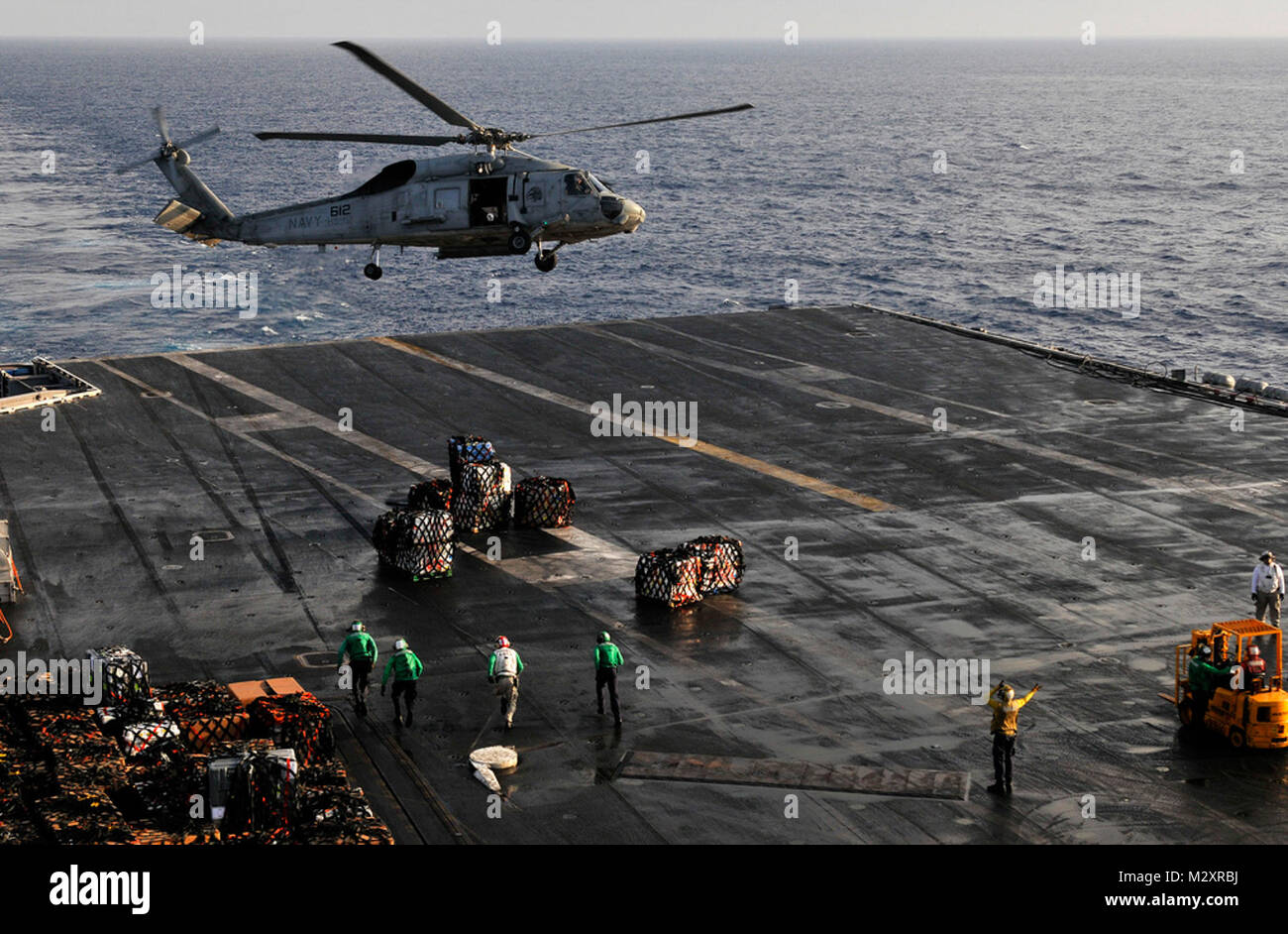An HH-60H Seahawk delivers cargo to the flight deck by #PACOM Stock ...