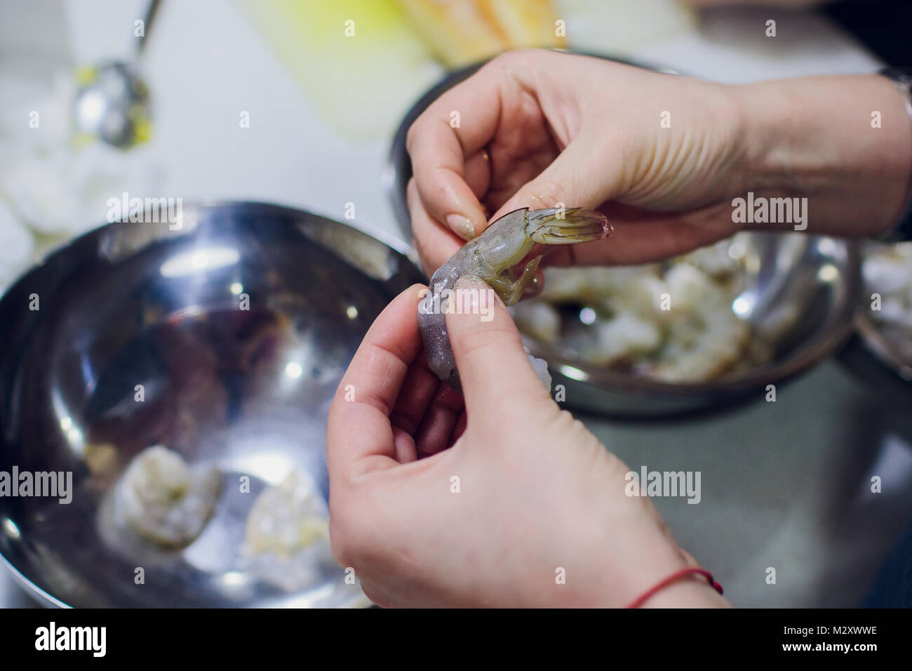 peeling shrimp before cooking food seafood red Stock Photo - Alamy