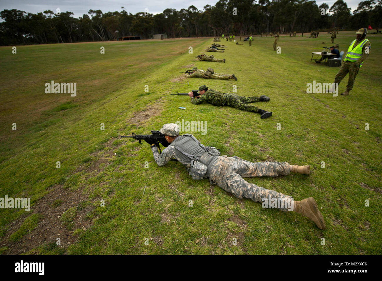 Service members from Australia, United States, and Singapore fire at ...