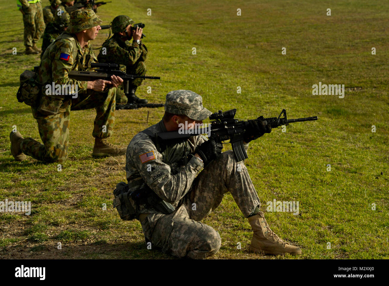 U.S. Army Sgt. Christopher Adams looks through his sites down range ...