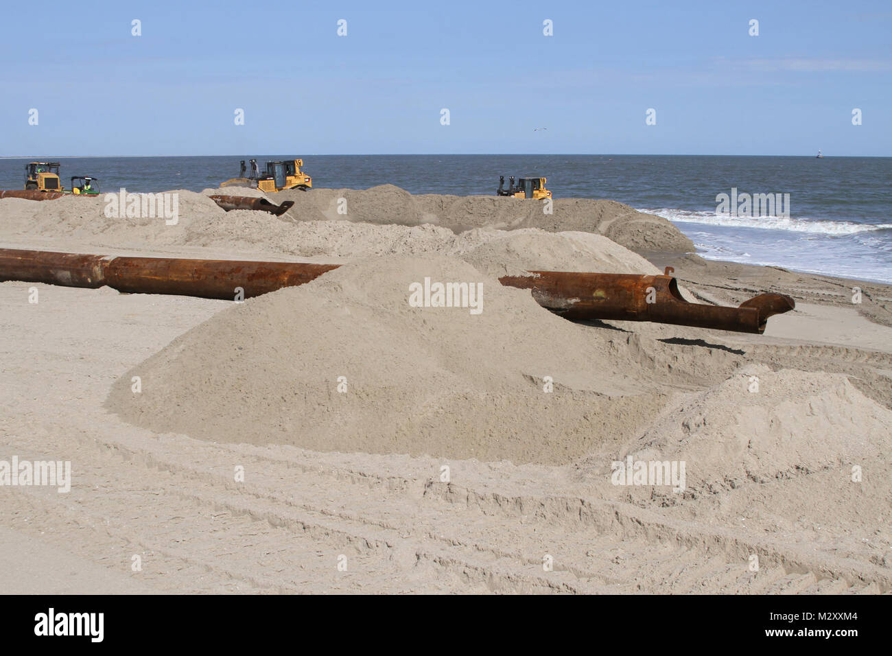 WALLOPS ISLAND, Va. – Pipes strewn along the newly built beach at NASA ...