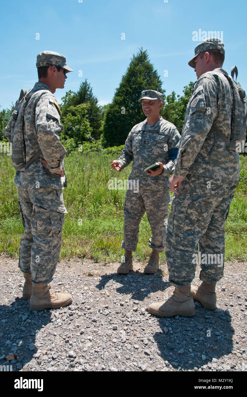 Sgt. 1st Class Jason Beshears (CENTER), a member of 1120th Asphalt Team ...