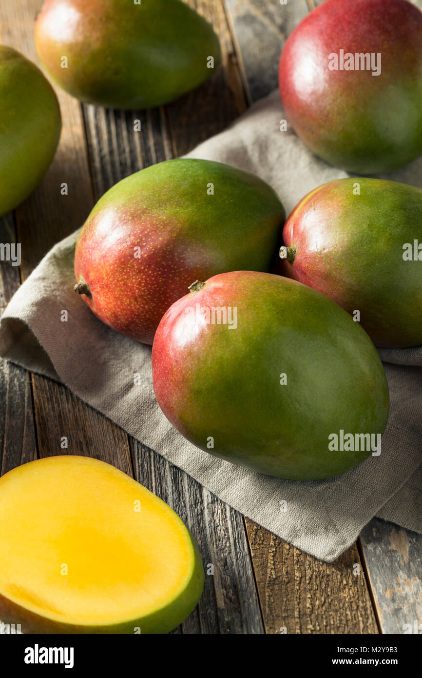Raw Red Green Organic Mango Fruit Ready to Eat Stock Photo - Alamy