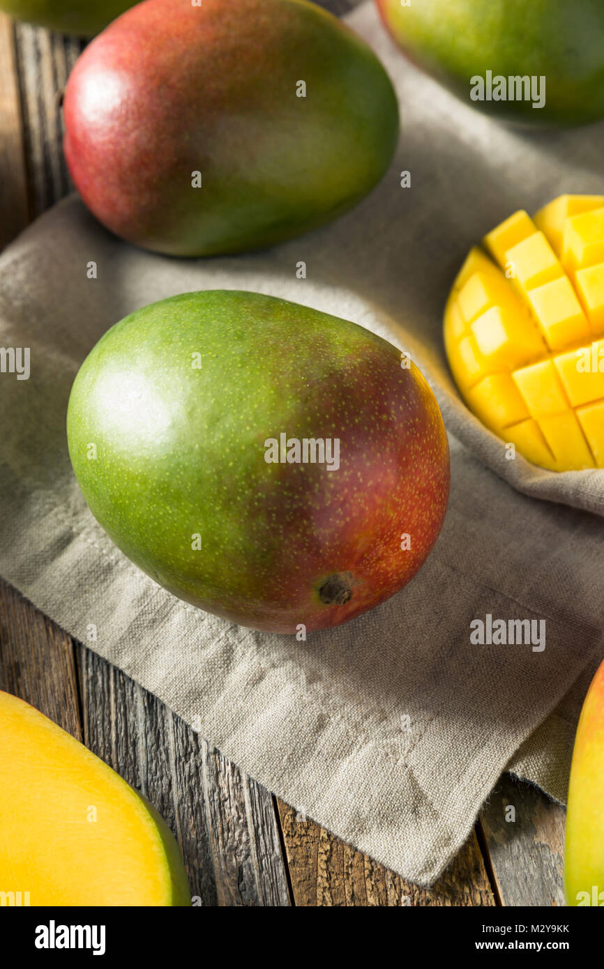 Raw Red Green Organic Mango Fruit Ready to Eat Stock Photo - Alamy