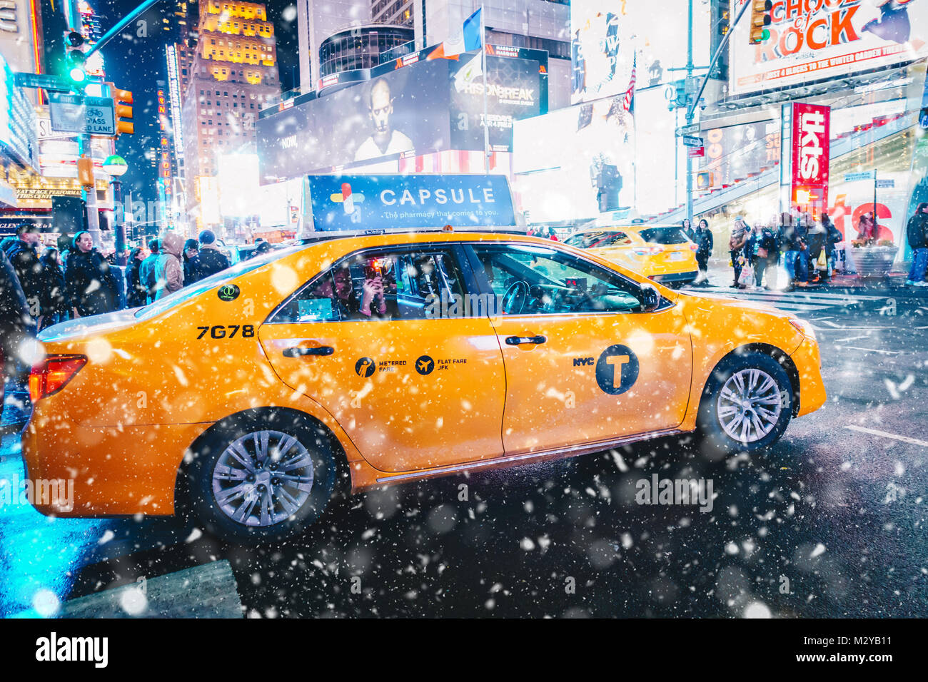 New York City, USA - March 18, 2017: People in yellow cab shot famous ...