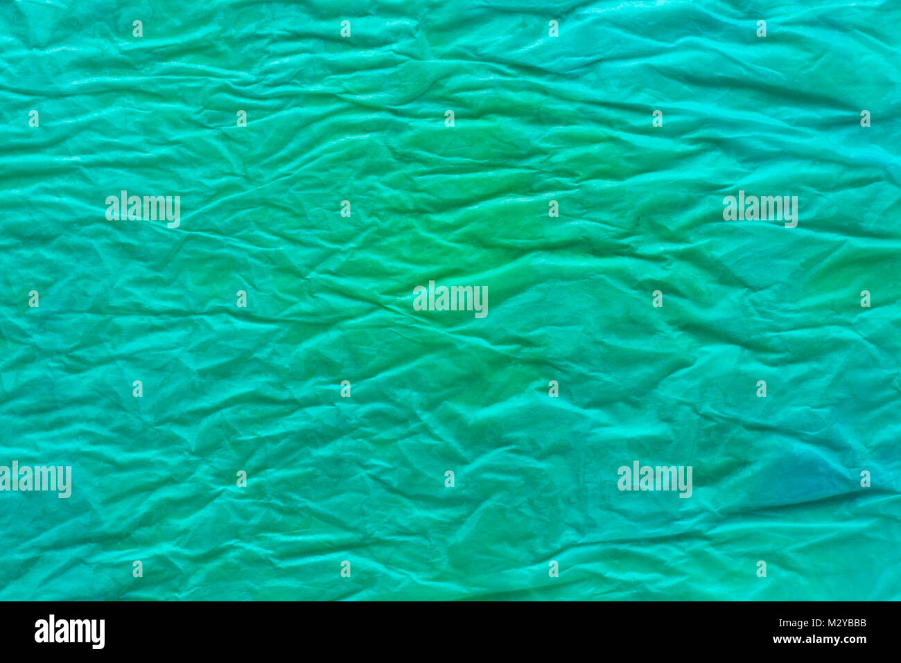 green color creased tissue paper bacground texture Stock Photo - Alamy