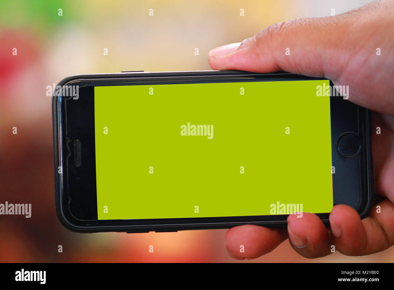 Young woman or man hand hold smart phone. Taking photo with a phone ...