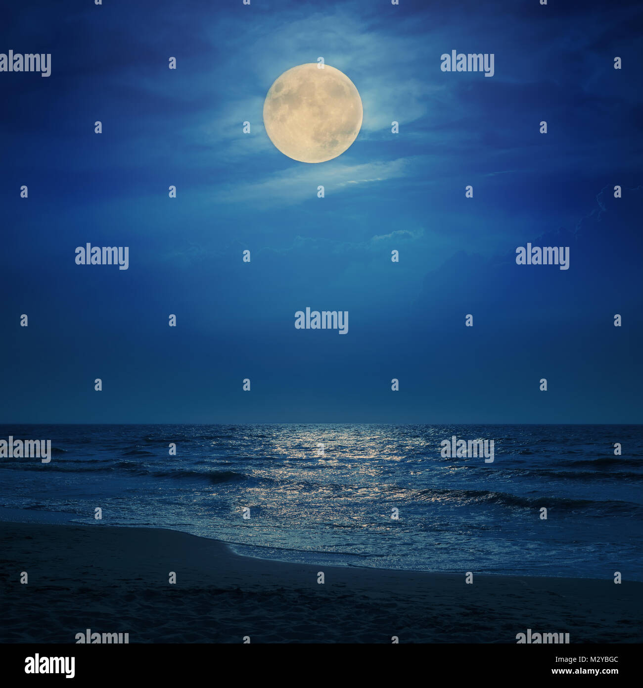 super moon in clouds over sea Stock Photo - Alamy