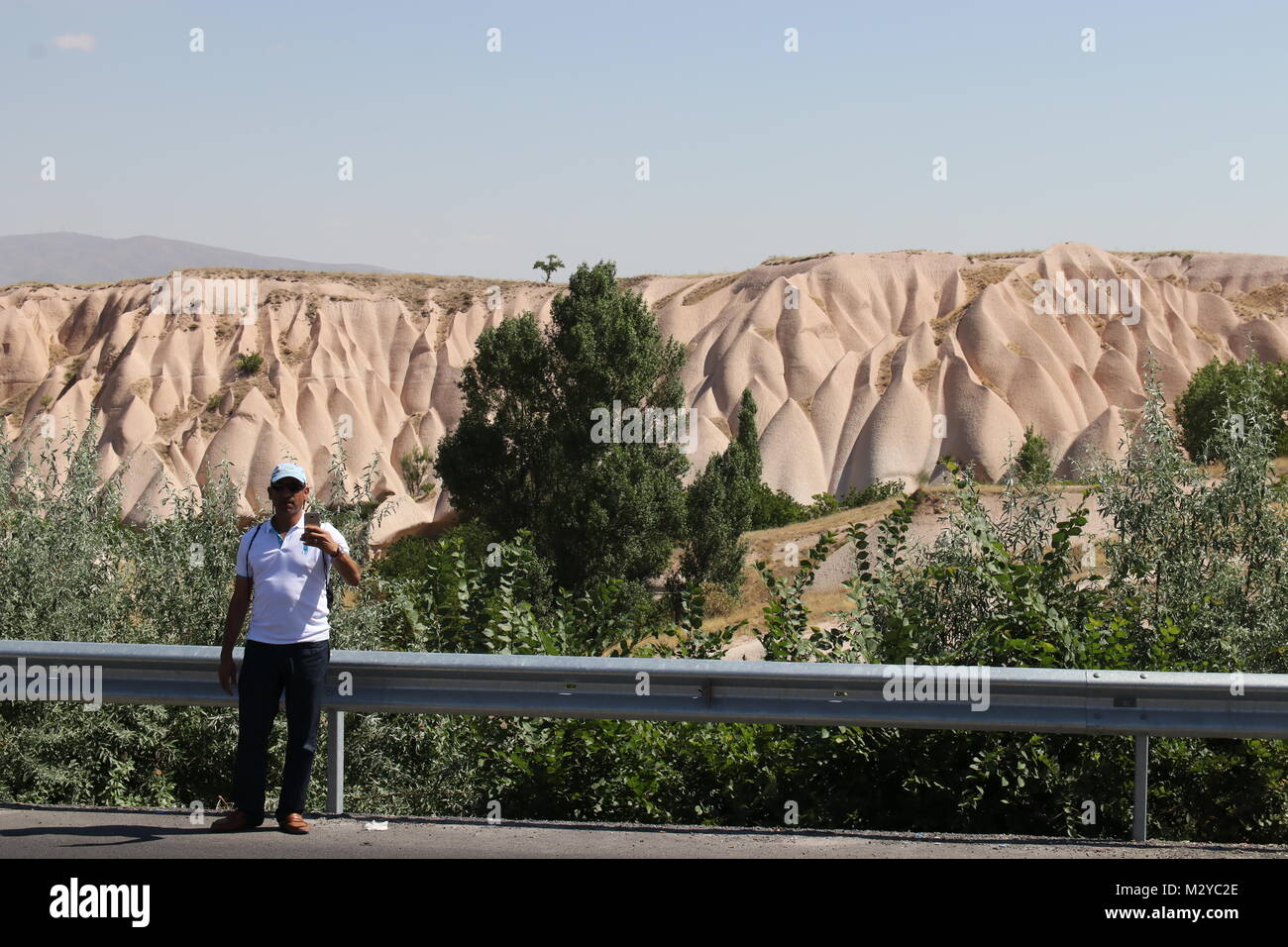 Tourists visiting some of the famous Fairy chimneys in Cappadocia which ...