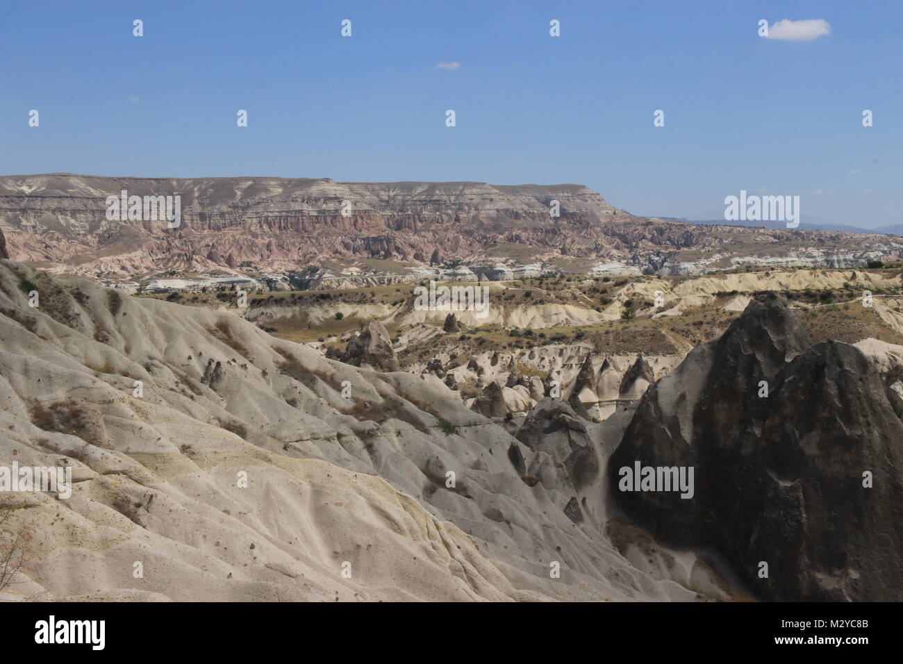 Tourists visiting some of the famous Fairy chimneys in Cappadocia which ...