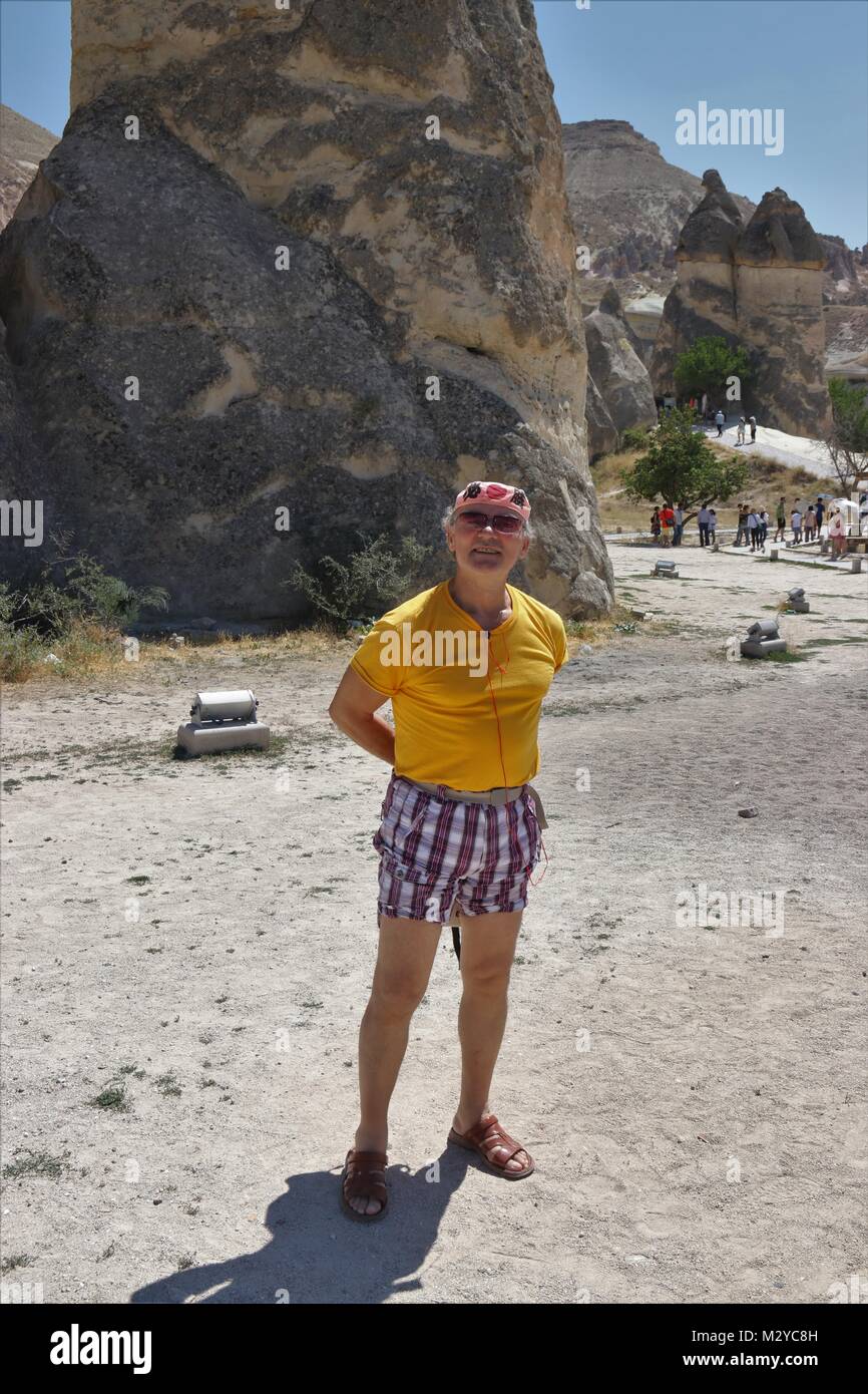 Tourists visiting some of the famous Fairy chimneys in Cappadocia which ...