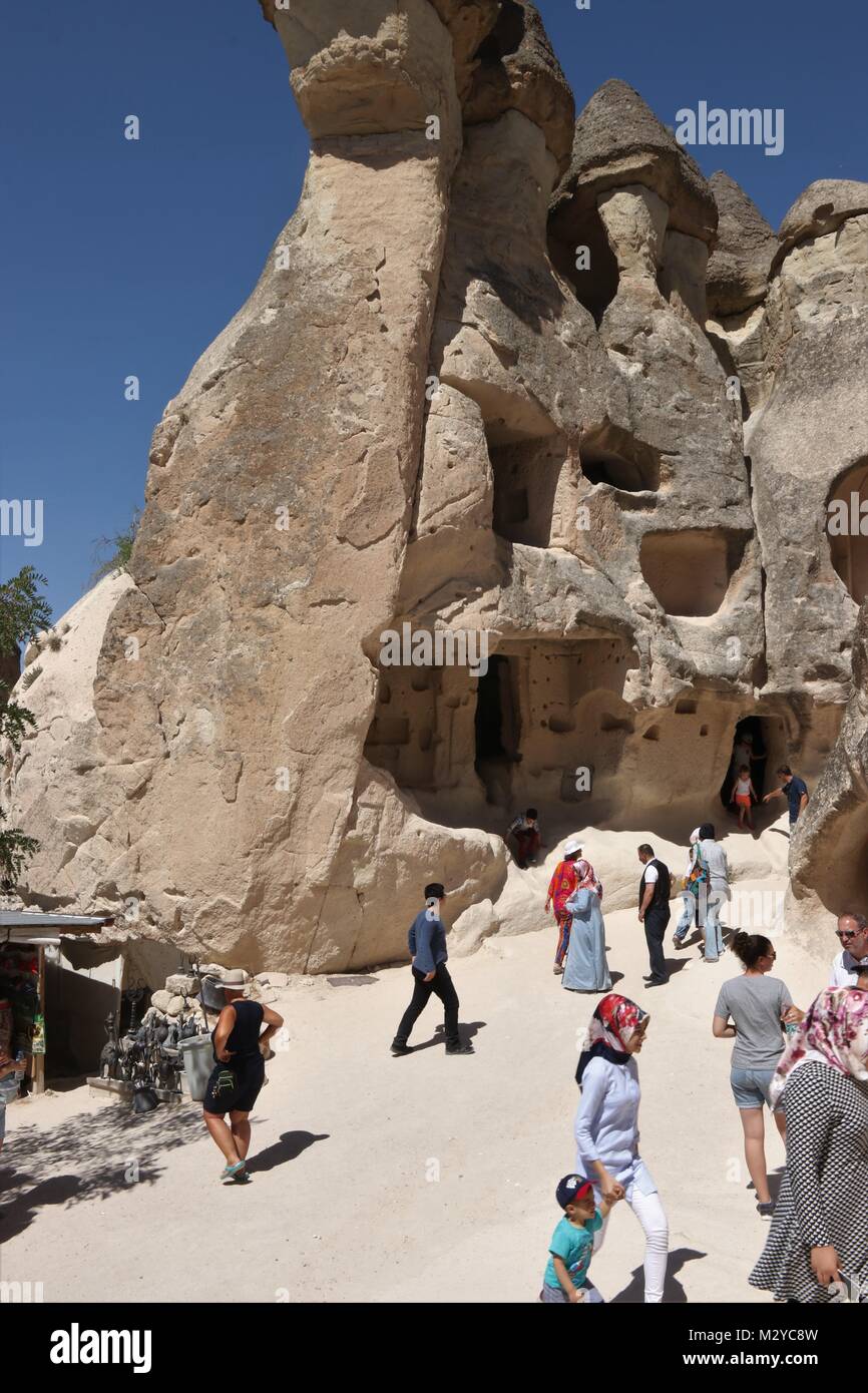 Tourists visiting some of the famous Fairy chimneys in Cappadocia which ...
