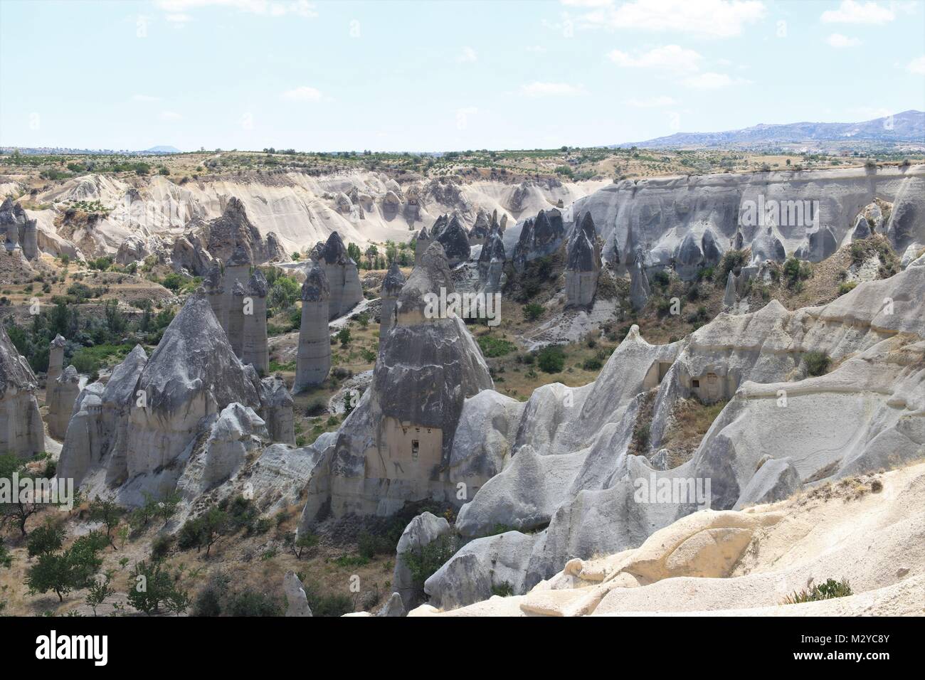 Tourists visiting some of the famous Fairy chimneys in Cappadocia which ...