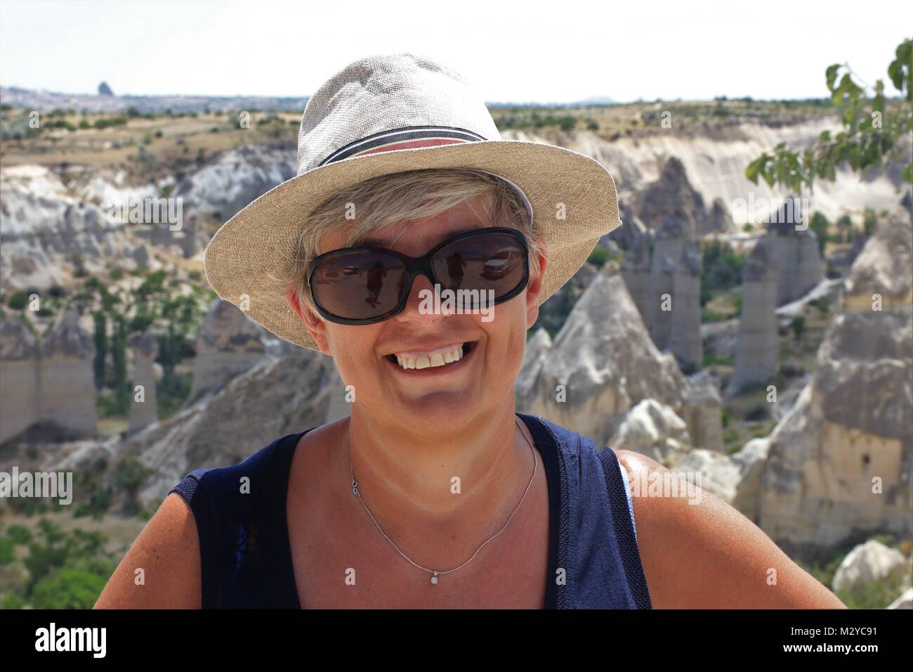 Tourists visiting some of the famous Fairy chimneys in Cappadocia which ...