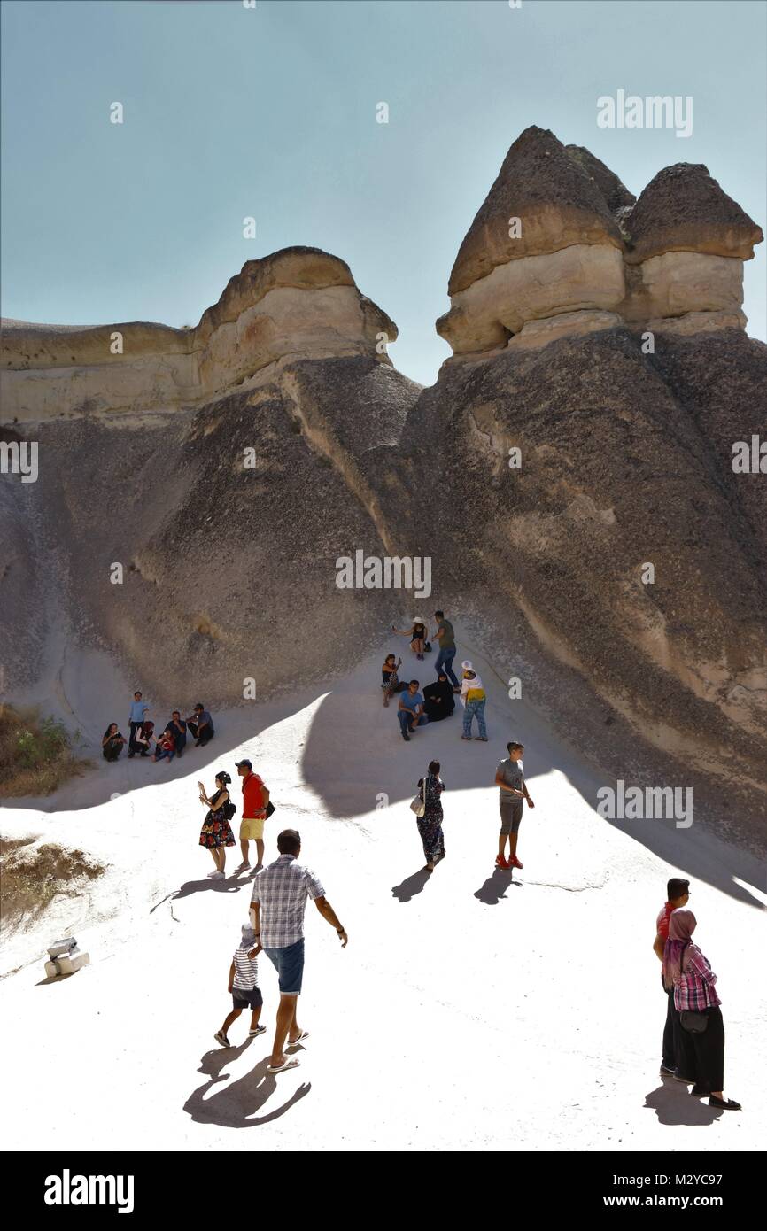 Tourists visiting some of the famous Fairy chimneys in Cappadocia which ...